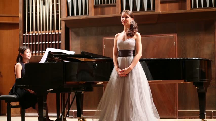 Woman Pianist Plays The Piano And Beautiful Singer Emotionally Sing ...