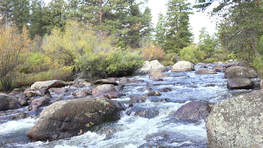 Stock video of water flowing over rocks in a | 7736803 | Shutterstock