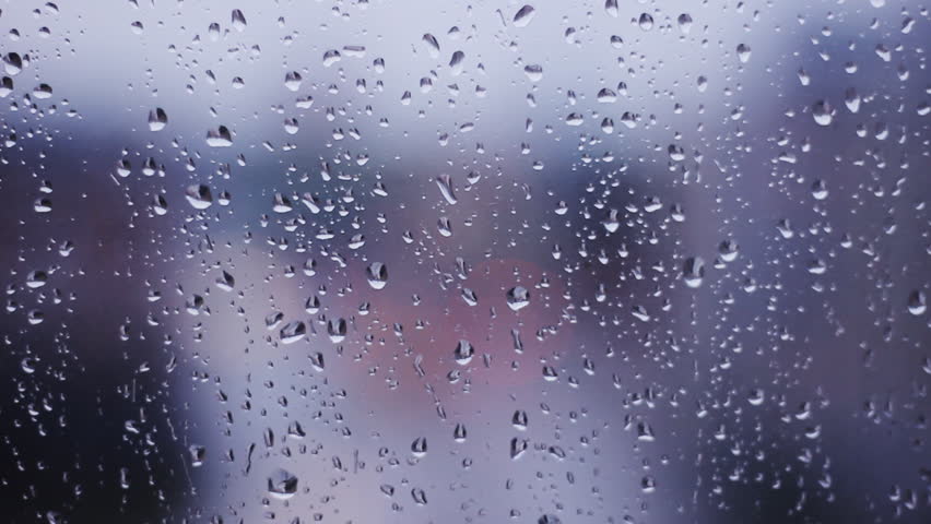 Rain Drops On Window Out Of Focus Traffic In The Background Blurry ...