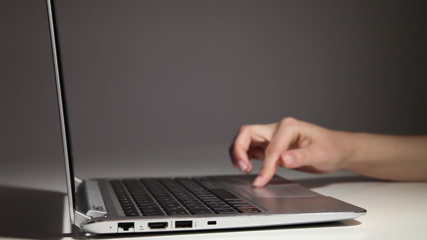 Hands Type On A Laptop Computer, While The Right Side Of The Screen Has ...