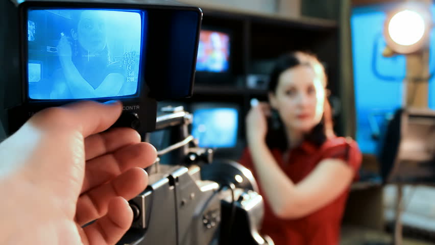 TV Reporter In Front Of The Studio Camera ; Beautiful Newscaster ...