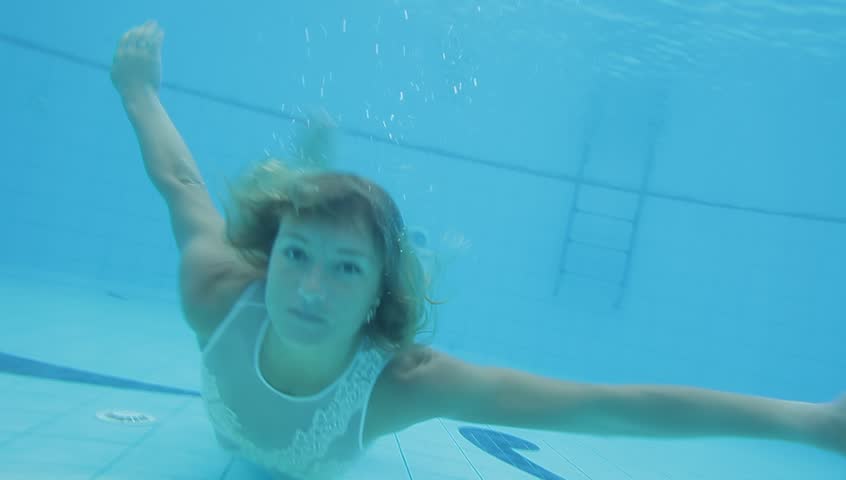 Beautiful Blonde Girl In White Bikini Is Swimming Underwater Showing Ok Sign And Smiling Stock